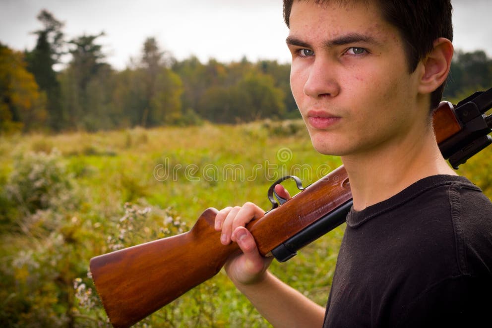 Young man with rifle stock photo. Image of outdoor, season - 21307936