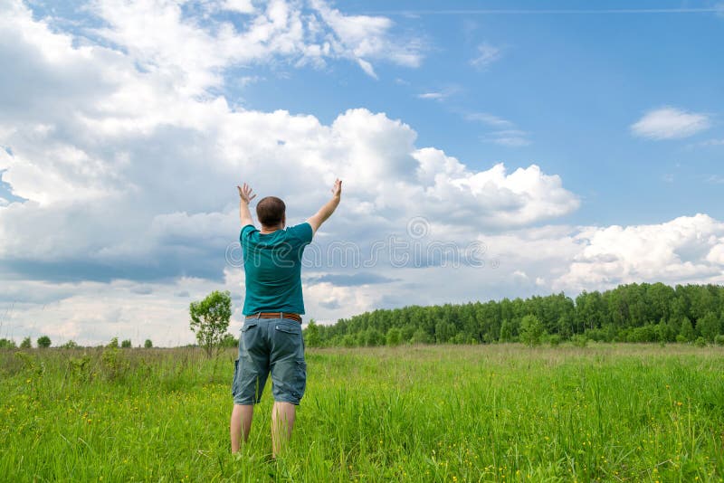 Young man rising hands stock photo. Image of back, cloud - 72240416