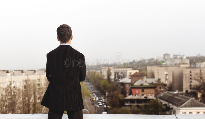 Young Man on the Roof of a Tall House Stock Image - Image of happiness ...