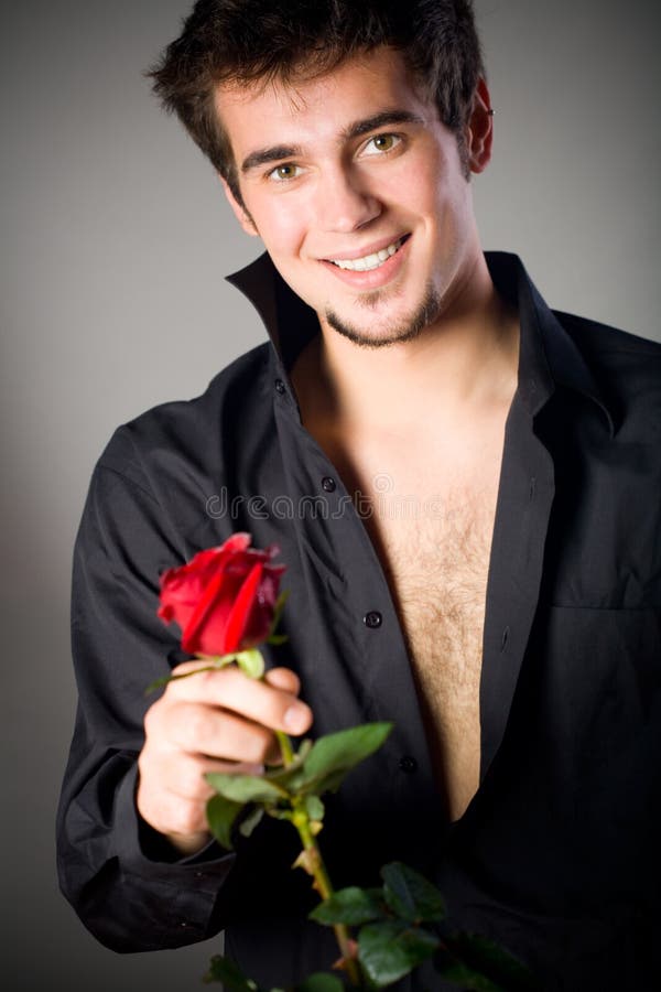 Young man with rose stock photo. Image of cheerful, youth - 2984436