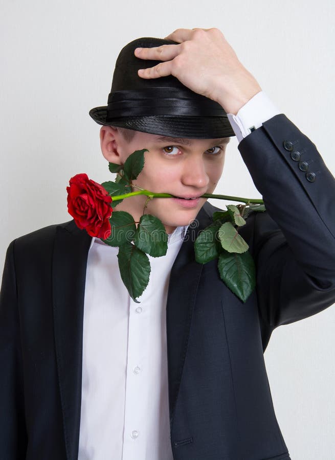 A young man with a rose stock photo. Image of dating - 37264126