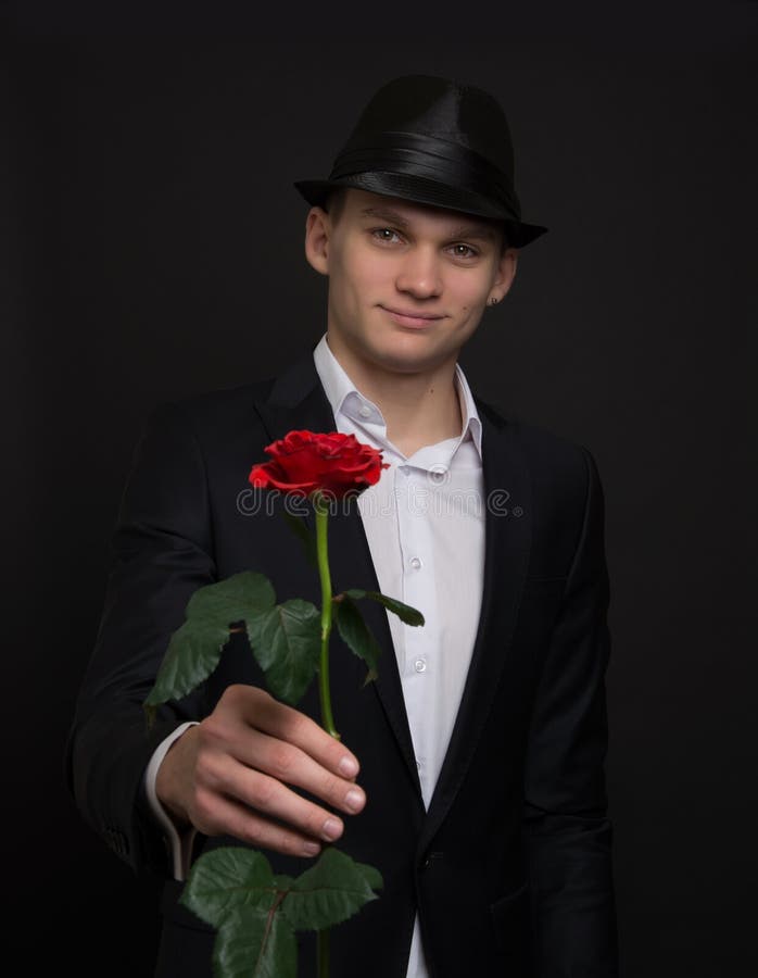 A young man with a rose. stock image. Image of giving - 37197467