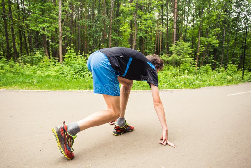 Young Man Runner Getting Ready for a Run on Track Stock Image - Image ...
