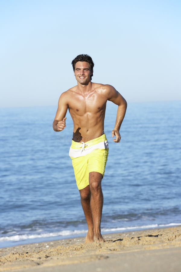 Young Man Running Along Summer Beach Stock Photo - Image of happy ...