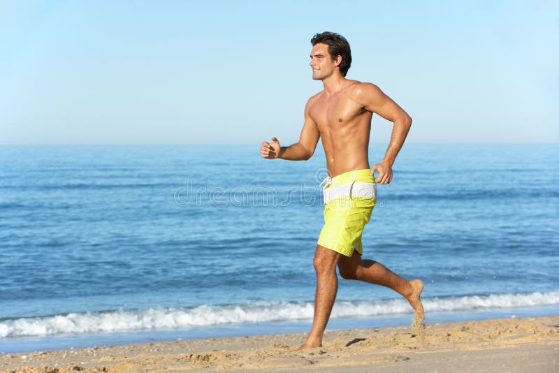 Young Man Running Along Summer Beach Stock Photo - Image of shoreline ...