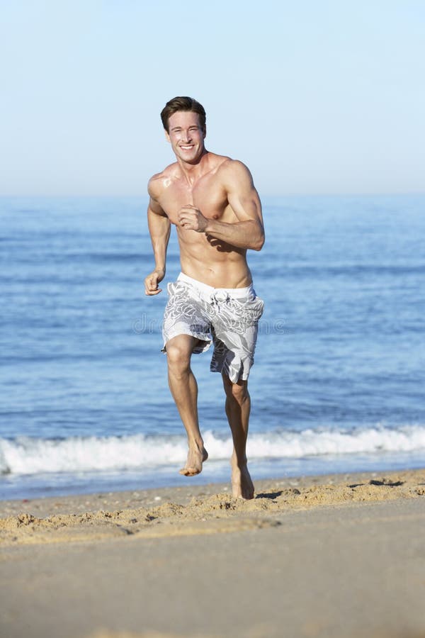 Young Man Running Along Summer Beach Stock Photo - Image of running ...