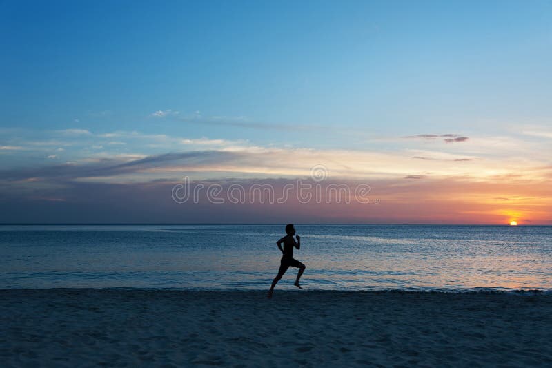 Man running on the beach stock image. Image of running, jogging - 88381