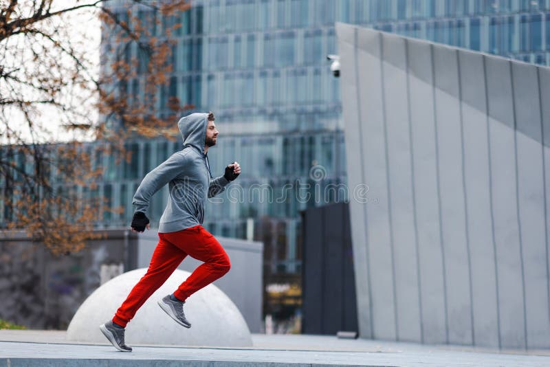Young Man Running in the City Stock Photo - Image of headphones ...