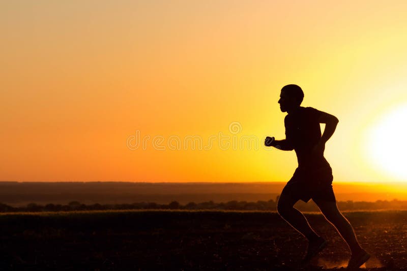 Young Man Running in the Field Stock Photo - Image of jogging, purpose ...