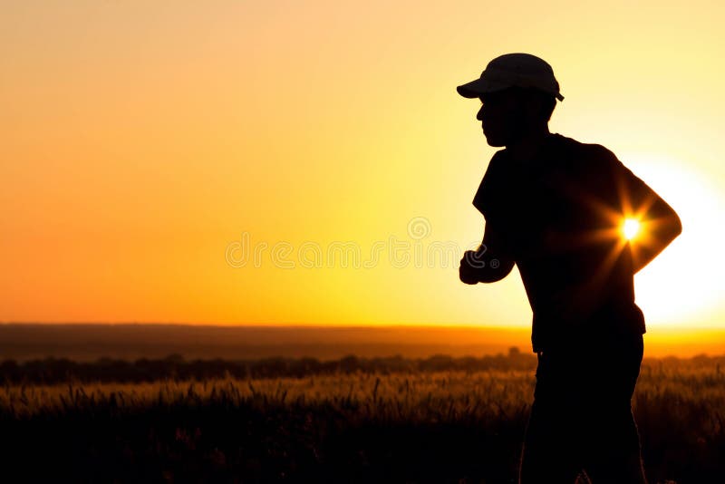 Young Man Running in the Field Stock Photo - Image of horizon, nature ...