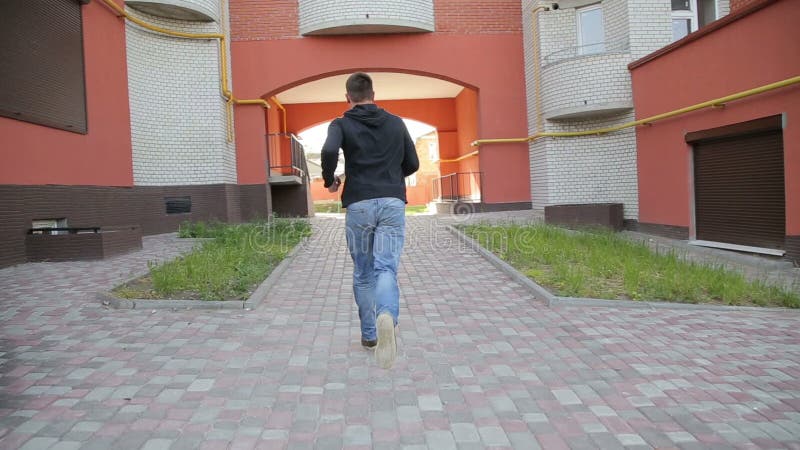 Young Man Running Outdoor, Near The Building Stock Footage - Video of ...