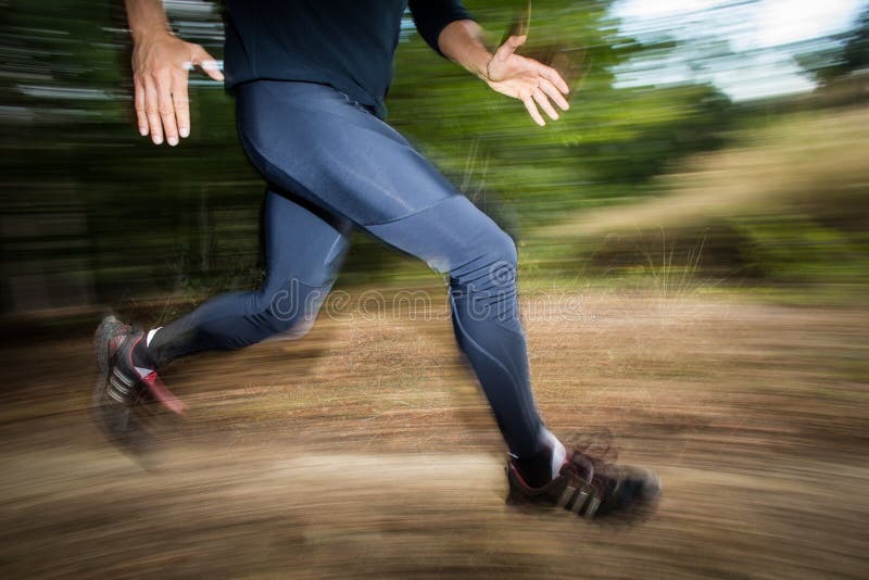 Young Man Running Outdoors in a Forest, Going Fast Stock Photo - Image ...