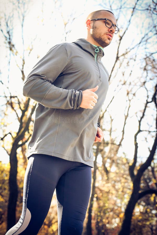 Young Man Running Outside. on the Move Stock Photo - Image of person ...