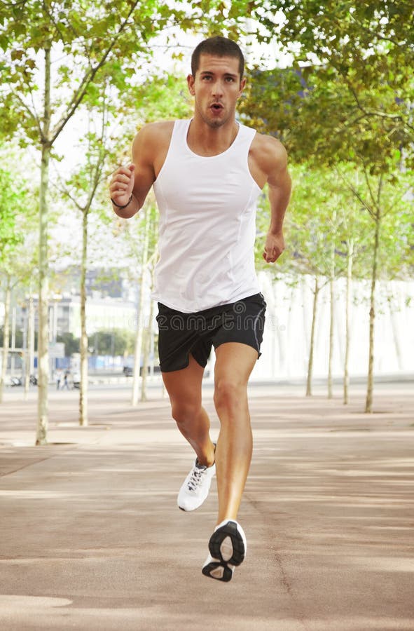 Young Man Running in the Park Stock Photo - Image of casual, active ...