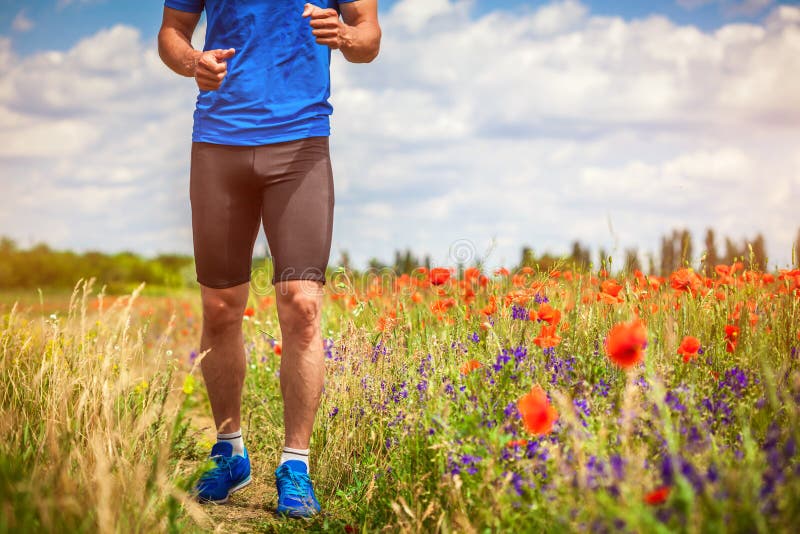Young Man Running on Poppy Field Stock Image - Image of shoes, athlete ...