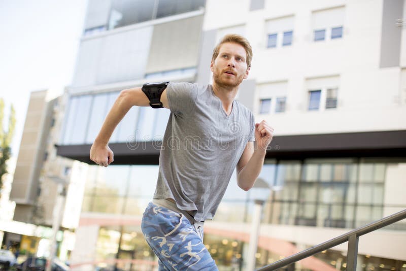 Young Man Running in the Urban Area Stock Photo - Image of urban ...