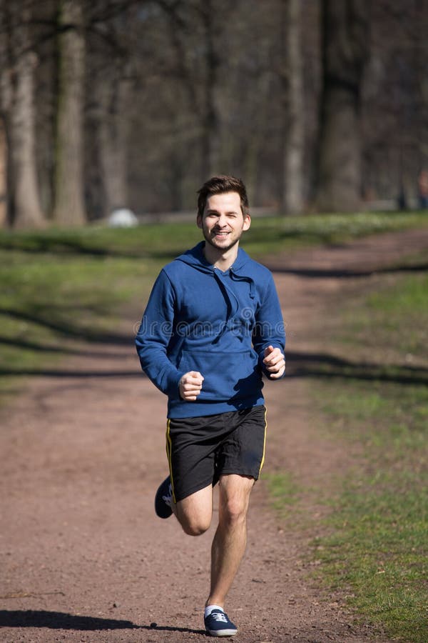 Young Man Runs through the Park Stock Photo - Image of move, exercise ...