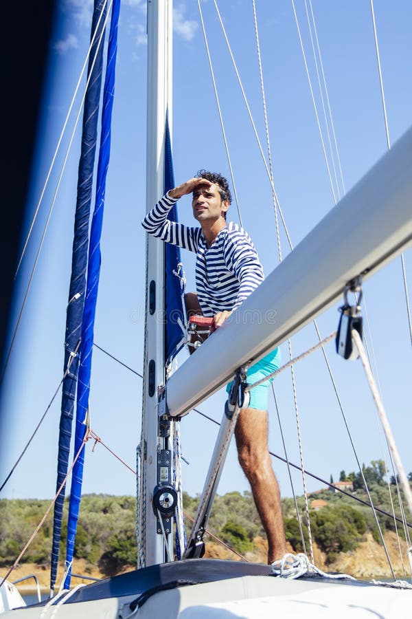 Young man on a sailboat stock image. Image of rich, sailing - 162965805