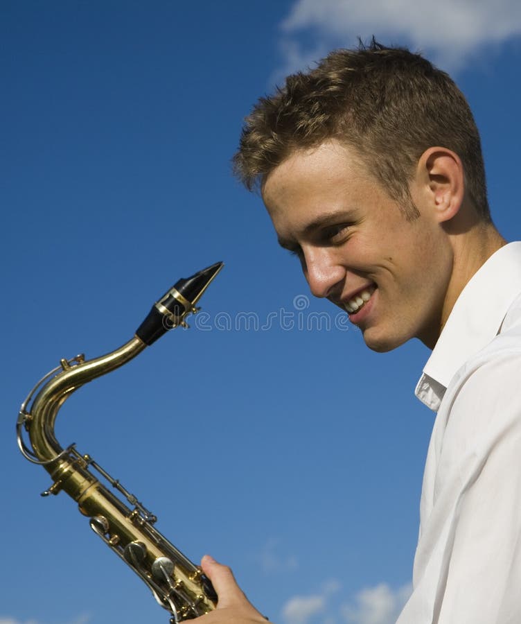 Young man with saxophone stock photo. Image of instrument - 4568890