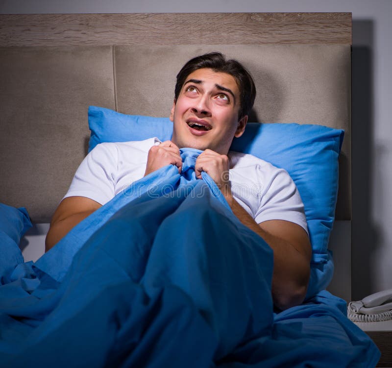The Young Man Scared in Bed Stock Photo - Image of horror, bedtime ...