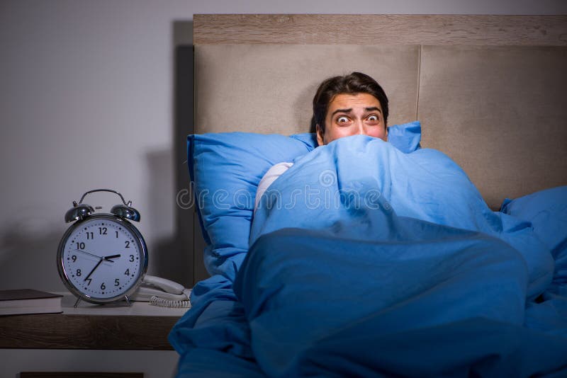 The Young Man Scared in Bed Stock Image - Image of childhood, insomnia ...