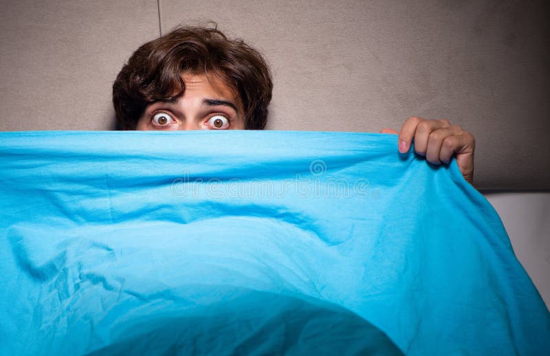 The Young Man Scared in His Bed Having Nightmares Stock Photo - Image ...