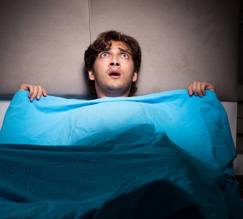 Young Man Scared in His Bed Having Nightmares Stock Photo - Image of ...