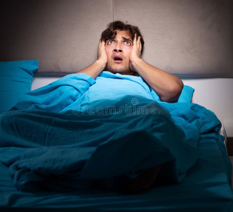 Young Man Scared in His Bed Having Nightmares Stock Photo - Image of ...