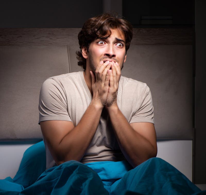 Young Man Scared in His Bed Having Nightmares Stock Image - Image of ...