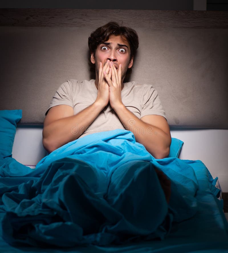 Young Man Scared in His Bed Having Nightmares Stock Photo - Image of ...