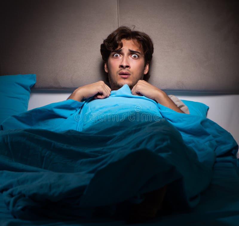 Young Man Scared in His Bed Having Nightmares Stock Image - Image of ...