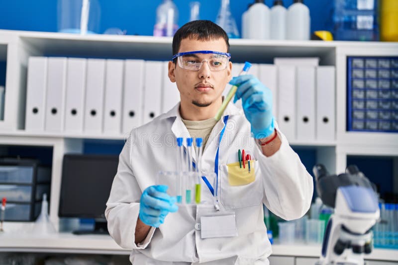 Young Man Scientist Holding Test Tubes at Laboratory Stock Photo ...