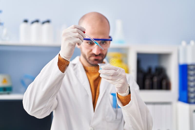 Young Man Scientist Measuring Liquid at Laboratory Stock Photo - Image ...