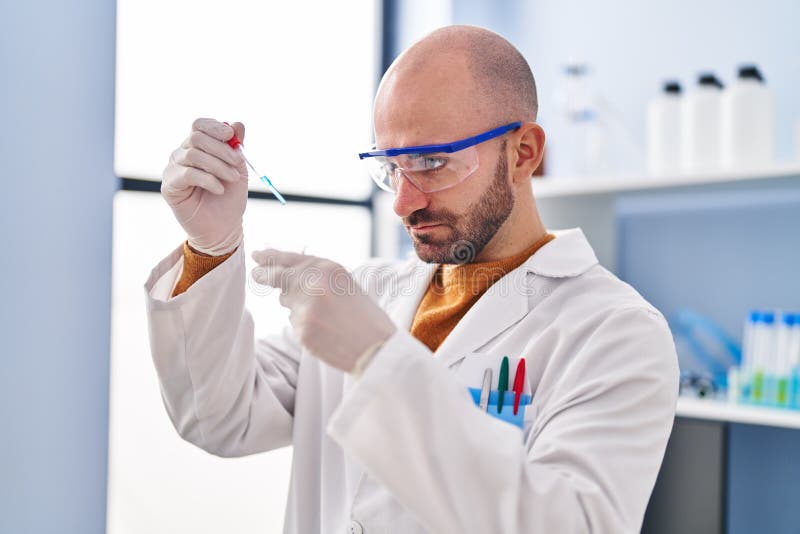 Young Man Scientist Measuring Liquid at Laboratory Stock Photo - Image ...