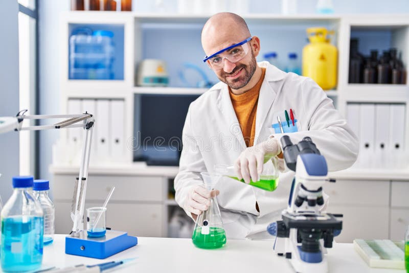 Young Man Scientist Measuring Liquid at Laboratory Stock Image - Image ...