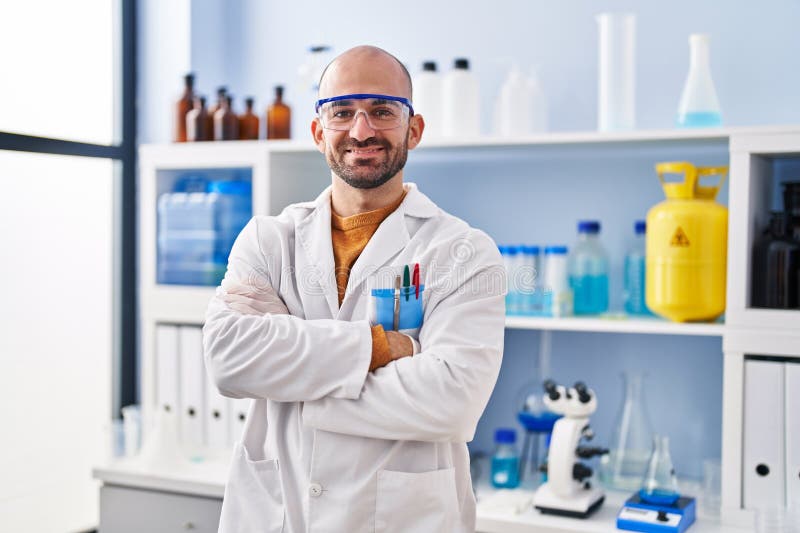 Young Man Scientist Standing with Arms Crossed Gesture at Laboratory ...