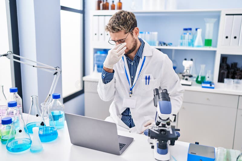 Young Man Scientist Stressed Using Laptop Working at Laboratory Stock ...