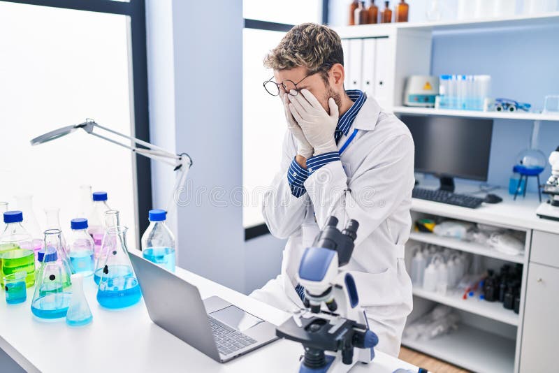 Young Man Scientist Stressed Using Laptop Working at Laboratory Stock ...