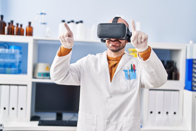 Young Man Scientist Using Virtual Reality Goggles at Laboratory Stock ... Young Man Scientist Using Virtual Reality Goggles at Laboratory Stock ...