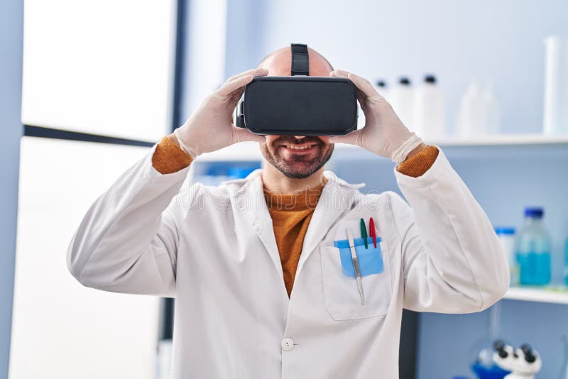 Young Man Scientist Using Virtual Reality Goggles at Laboratory Stock ... Young Man Scientist Using Virtual Reality Goggles at Laboratory Stock ...