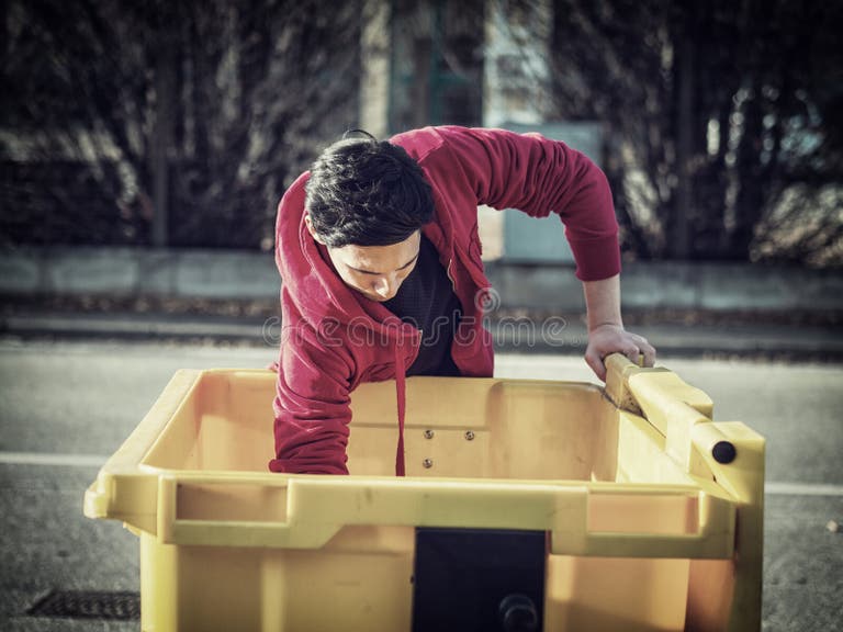 Young Man Searching Inside Garbage Bin for Stuff Stock Image - Image of ...