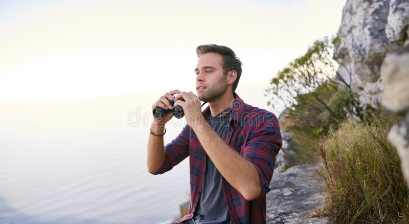 Young Man Searching for Sights with His Binoculars Outdoors Stock Image ...
