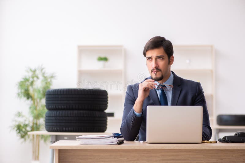 Young Man Selling Tires in the Office Stock Image - Image of wheel ...