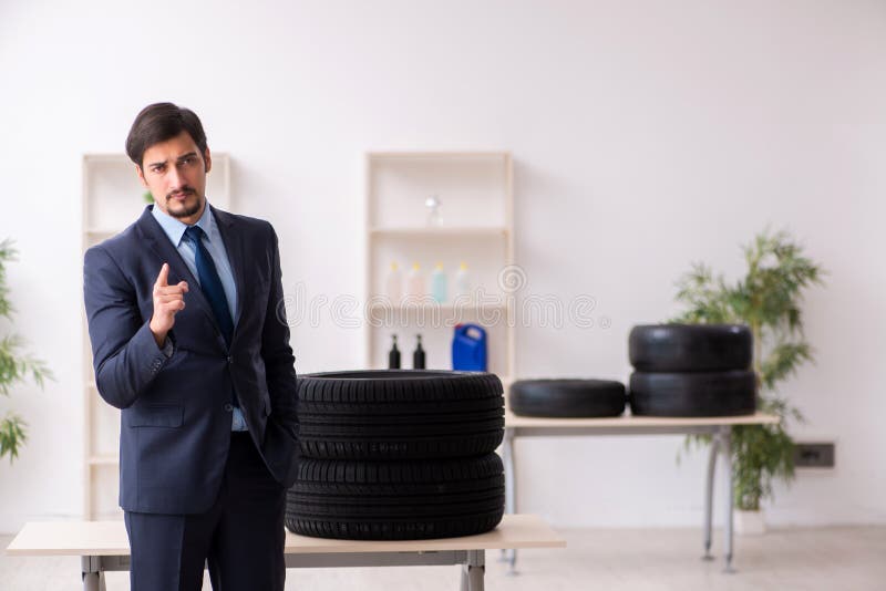 Young Man Selling Tires in the Office Stock Photo - Image of speed ...