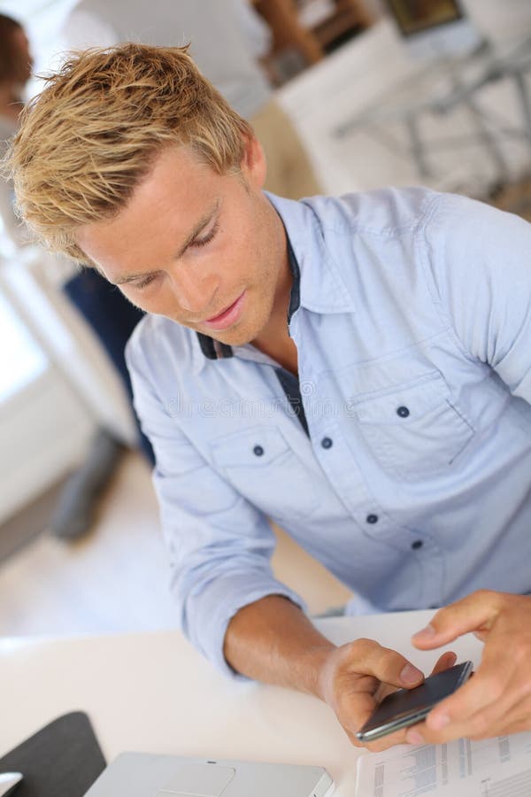 Young Man Sending Message with Smartphone Stock Photo - Image of ...