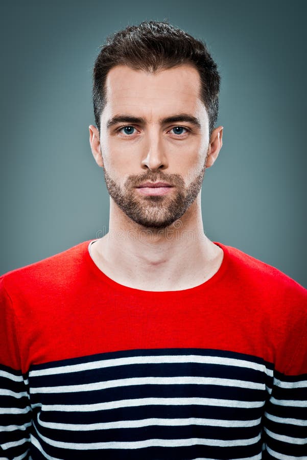 Young Man with Serious Expression Stock Photo - Image of people, adult ...