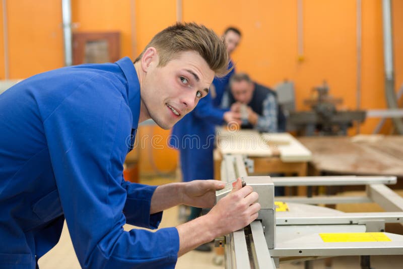 Young Man Setting Up Equipment in Woodwork Class Stock Image - Image of ...
