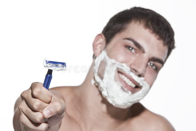 Young man shaving stock photo. Image of grooming, vertical - 10871316