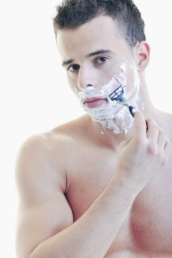 Young man shaving stock photo. Image of grooming, casual - 14384004