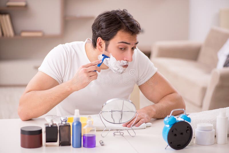 Young Man Shaving Face at Home Stock Image - Image of skin, looking ...